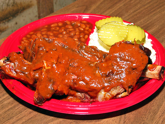 These ribs aren't just sauced &ndash; they're baptized. The deep red coating promises a flavor revelation that borders on religious experience.