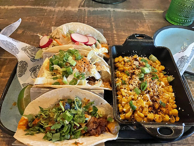 Taco assortment with street corn on the side&mdash;proof that sometimes the best combinations in life are the simplest ones.