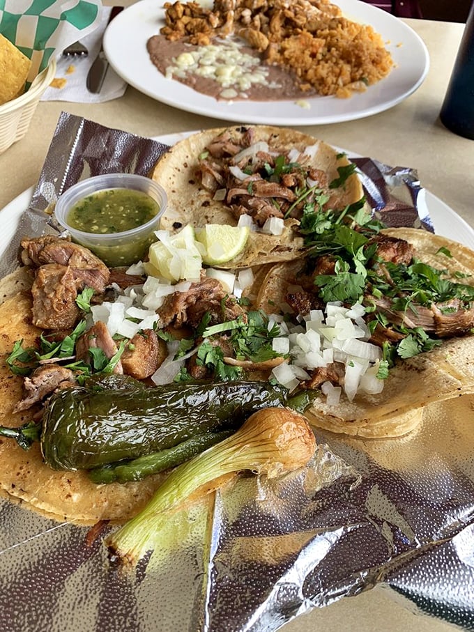 Carnitas tacos with all the fixings&mdash;the kind that make you close your eyes on the first bite. That grilled onion and jalape&ntilde;o are the backup singers that steal the show.