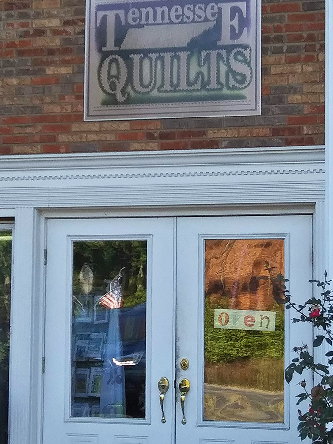 Tennessee's quilting tradition lives on behind these blue doors, where fabric masterpieces tell stories stitch by colorful stitch.