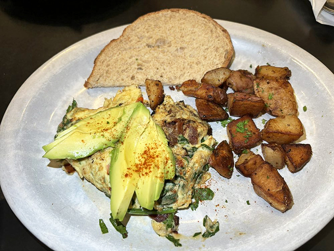 Pancakes, bacon, and eggs—the holy trinity of breakfast. That light dusting of powdered sugar is like morning's first snowfall on a delicious landscape.
