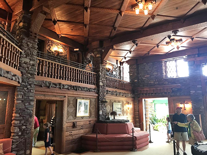 The Great Room soars with dramatic flair, its stone columns and wooden balconies creating the perfect stage for everyday life elevated to theatrical art.