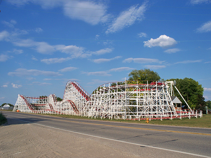 The Tornado roller coaster's white wooden structure rises from the landscape like the skeleton of a friendly dinosaur, promising just enough thrill without modern-day extremes.