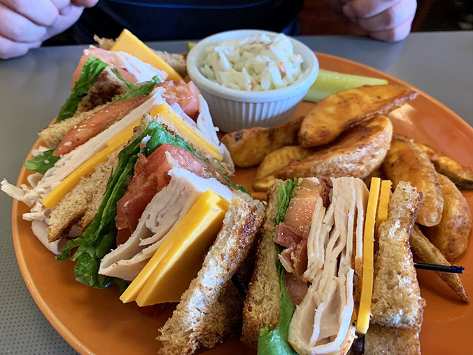 Club sandwiches: the skyscrapers of the sandwich world. This triple-decker beauty with its perfectly toasted bread corners makes lunch feel like a celebration.