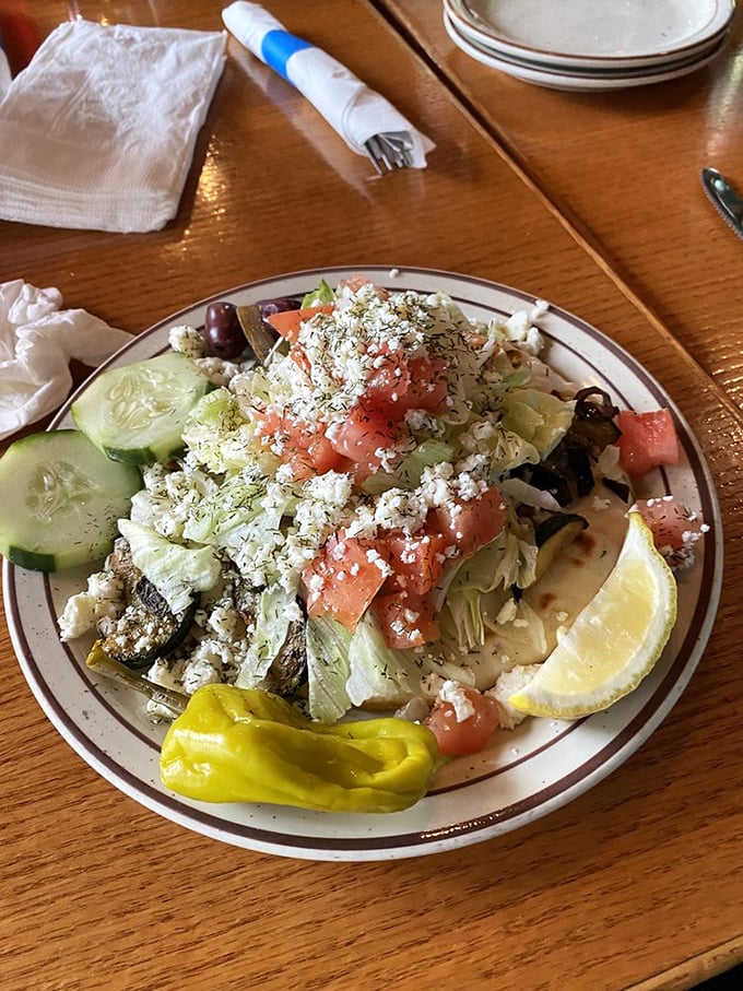A garden of delights on a plate. Fresh vegetables, creamy feta, and vibrant tomatoes prove that Greek cuisine celebrates produce as much as protein.