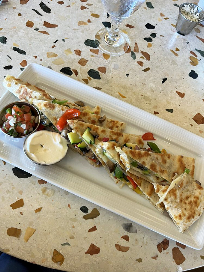Not in a seafood mood? This quesadilla brings the fiesta to your table with colorful veggies and melty cheese that stretches with each bite.