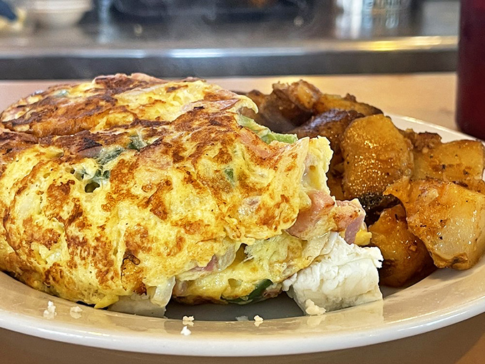 This isn't just an omelet&mdash;it's a masterclass in egg architecture. Stuffed with ham and veggies, it's breakfast engineering at its finest.