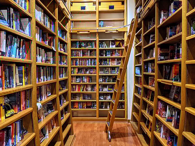 This narrow aisle of floor-to-ceiling books creates the literary equivalent of being hugged by knowledge from all sides.