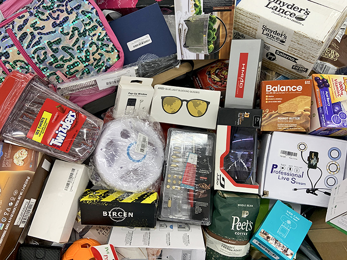 A kaleidoscope of possibilities! One bin's random assortment reveals everything from sunglasses to snacks, proving shopping here is like opening a surprise package.