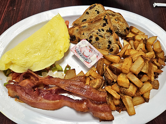 Breakfast perfection doesn't need to be complicated&mdash;just a fluffy omelet, crispy bacon, and home fries that could make a potato proud.