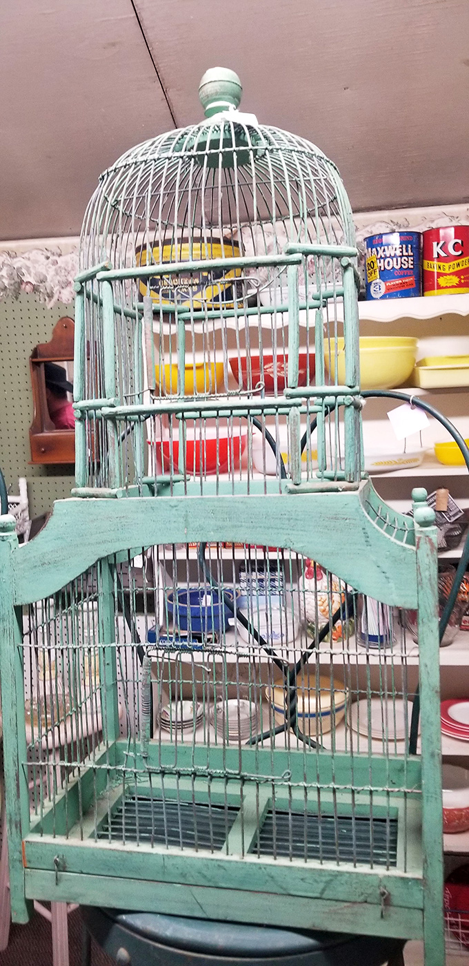 This mint-green birdcage isn't just decorative&mdash;it's architectural evidence of an era when pets were displayed like living ornaments in American homes.