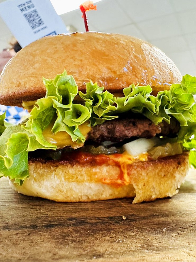 Behold the burger that launched a thousand road trips. That perfect char, those fresh toppings&mdash;it's not just lunch, it's edible architecture.