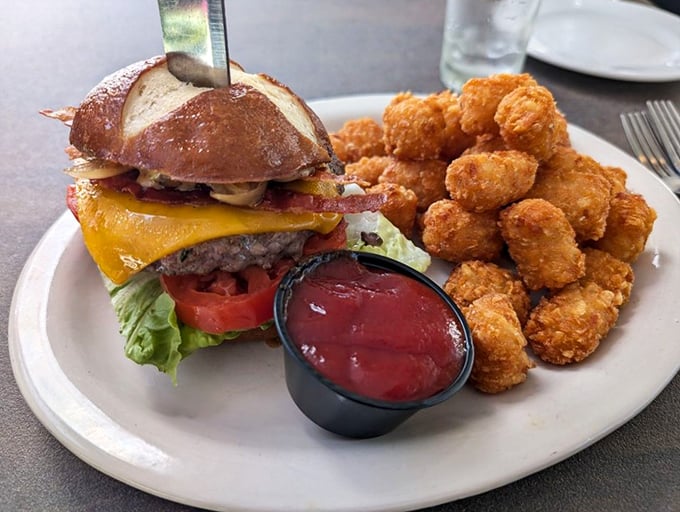 Even the burgers get the German treatment&mdash;this beauty perches on a pretzel bun, flanked by crispy tater tots that seem to multiply as you eat.