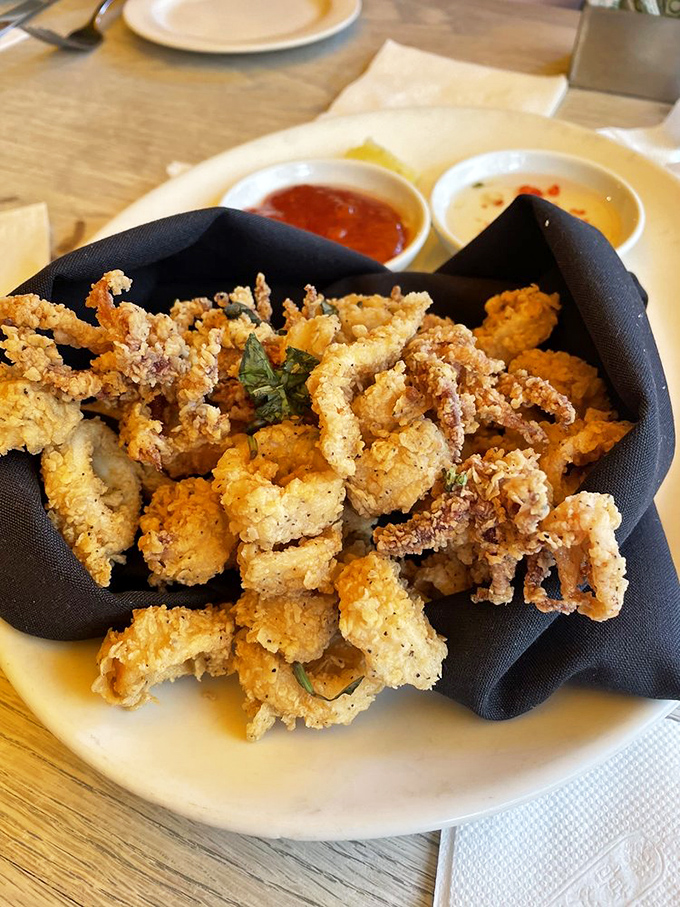 Crispy calamari that snaps rather than squeaks&mdash;perfectly golden, tender within, and served with dipping sauces worth fighting over.