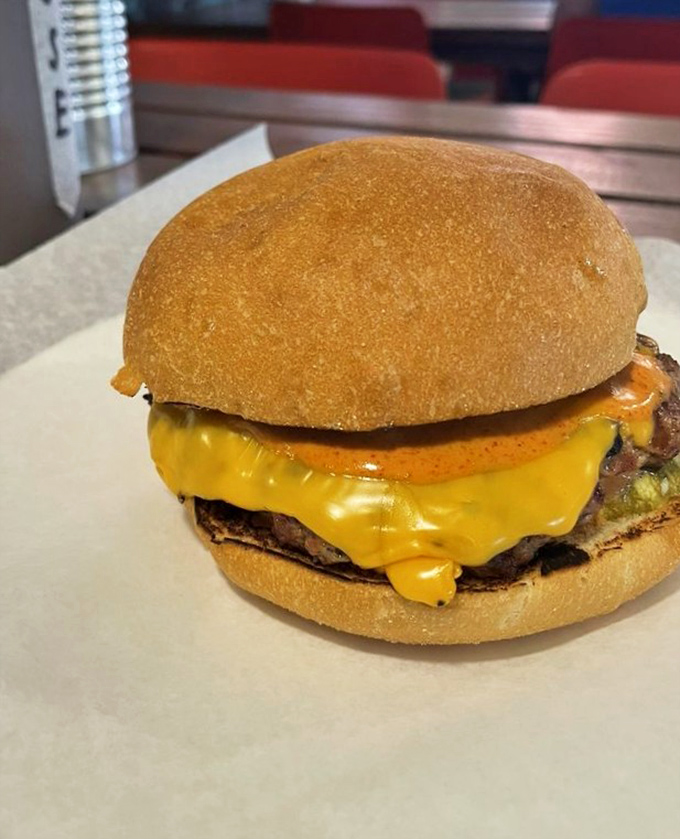This isn't just a cheeseburger; it's a masterclass in melty perfection that would make even the most dedicated health guru reach for a napkin.
