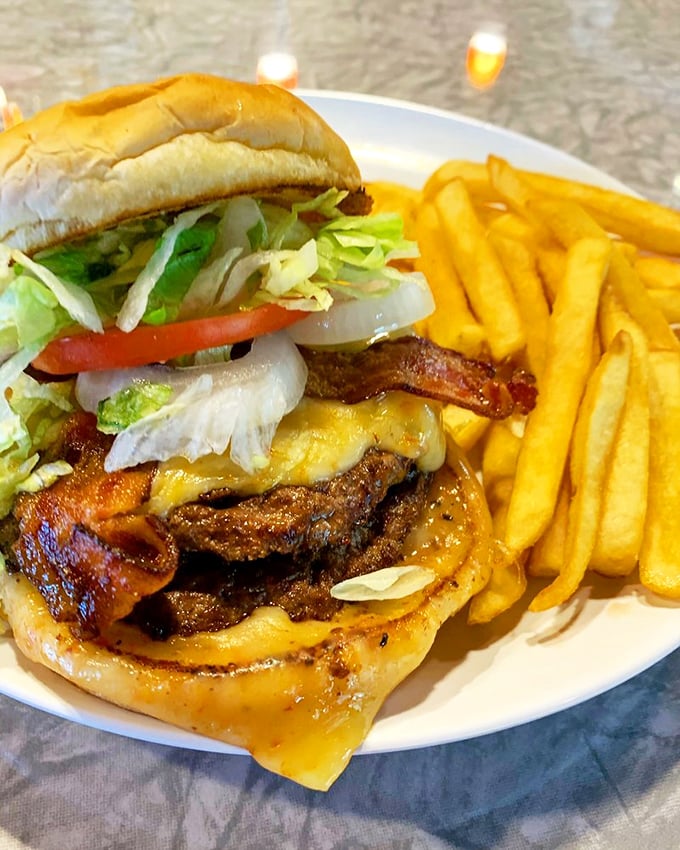 This isn't just a burger &ndash; it's a masterpiece of melty cheese, crisp bacon, and fresh toppings that requires both hands and several napkins.