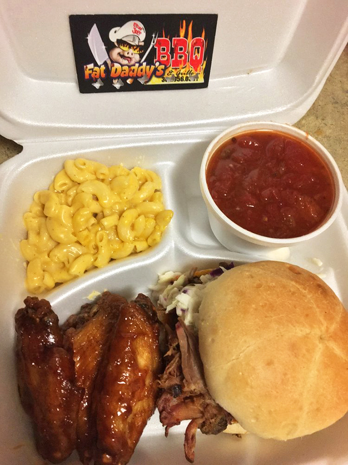 The holy trinity of BBQ: wings, mac and cheese, and a pulled pork sandwich. Not so much a meal as it is a religious experience with napkins.