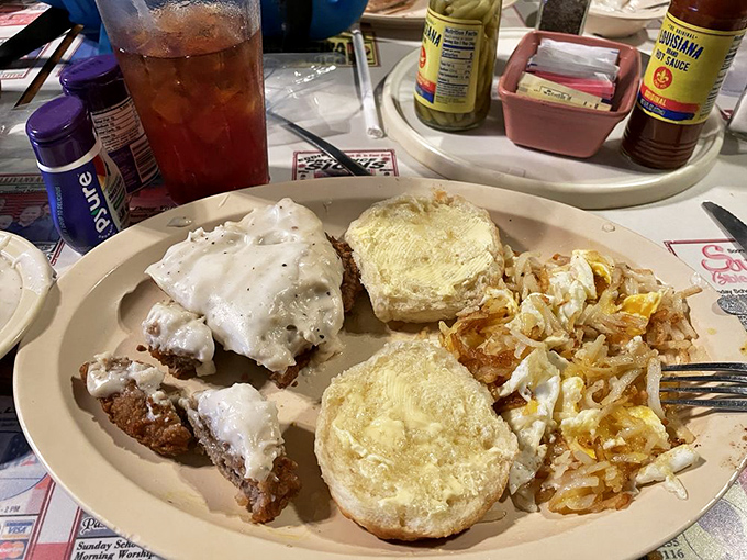 Country-fried steak smothered in pepper gravy alongside those legendary hash browns&mdash;a plate that says "you won't need dinner" in the most delicious way possible.