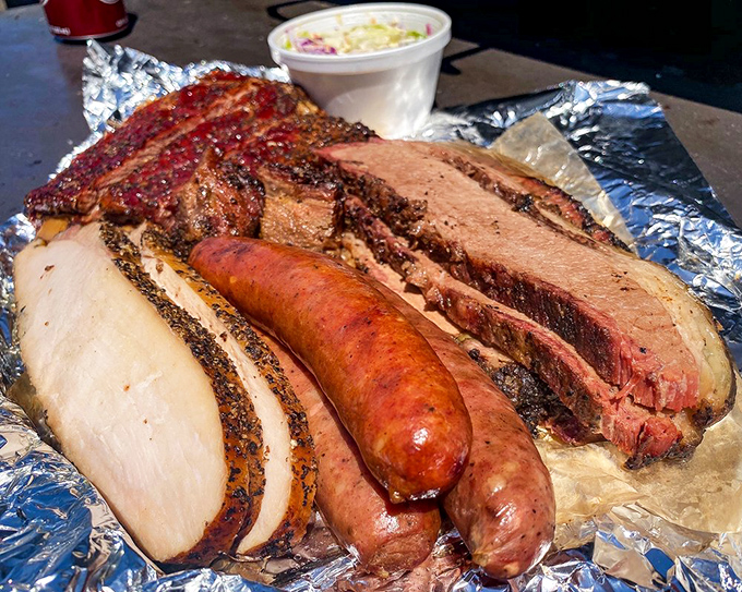 The carnivore's dream team: brisket, sausage, and turkey, playing together in perfect harmony. This isn't a meal; it's a meat symphony with sides as the supporting cast.