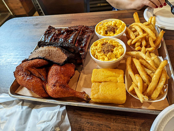 The holy trinity of barbecue: ribs, chicken, and sides that know their supporting role but still steal scenes. That cornbread deserves its own fan club. 