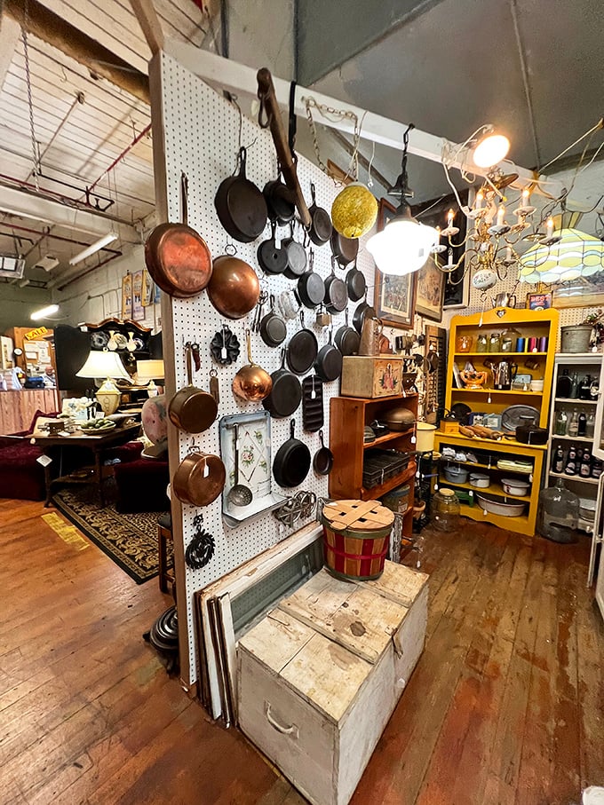 Cast iron heaven where cooking history hangs on display. Each pan tells a hundred stories of family dinners and secret recipes.
