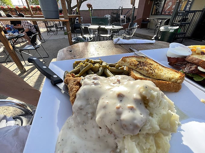 Country fried steak swimming in gravy&mdash;where comfort food goes to show off. This plate doesn't whisper "indulgence," it yells it from the mountaintops.