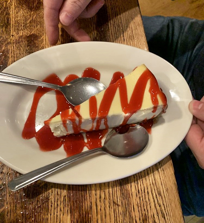 Cheesecake drizzled with ruby-red sauce—dessert's answer to a sunset over water. Simple, classic, and impossible to resist after all that seafood.