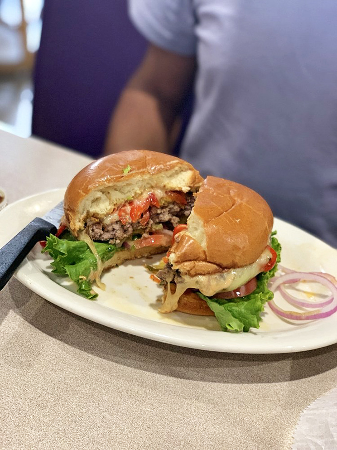 This isn't just a burger&mdash;it's an architectural marvel of bacon, cheese, and beef that requires both hands, several napkins, and zero shame.