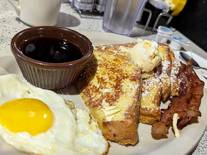 French toast that somehow remains crisp outside while maintaining a custard-like center&mdash;a textural masterpiece that will ruin all other French toast forever.