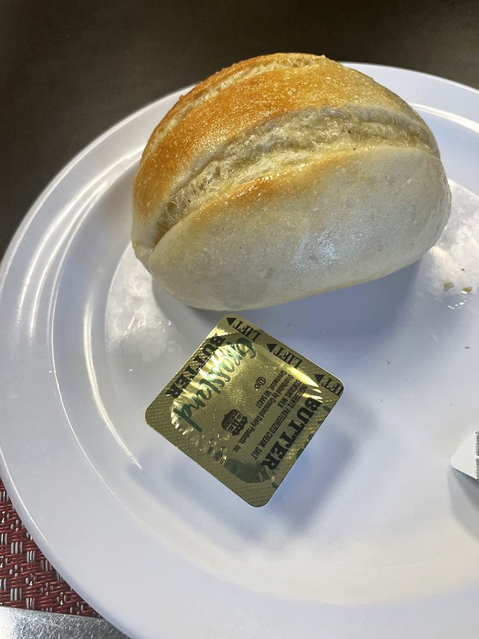 The humble bread roll, elevated to art form. That golden crust gives way to a pillowy interior that's begging for a swipe through sauce.