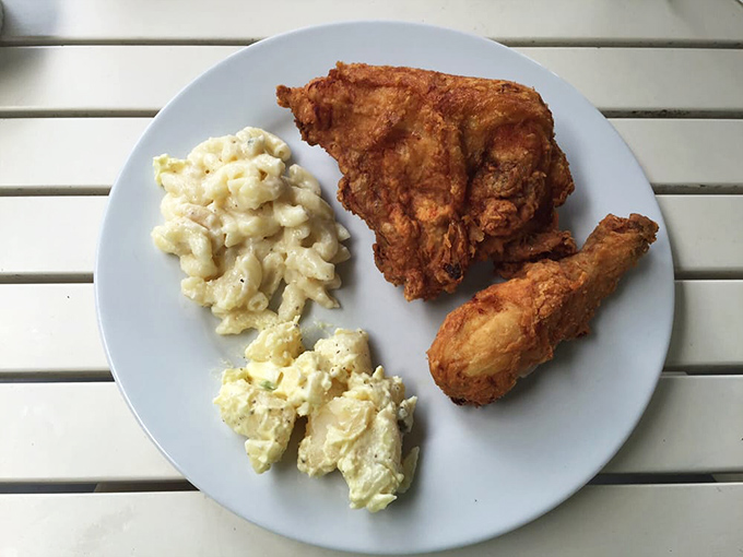 The holy trinity of comfort food: perfectly fried chicken, creamy mac and cheese, and potato salad that would make your grandmother both proud and jealous.