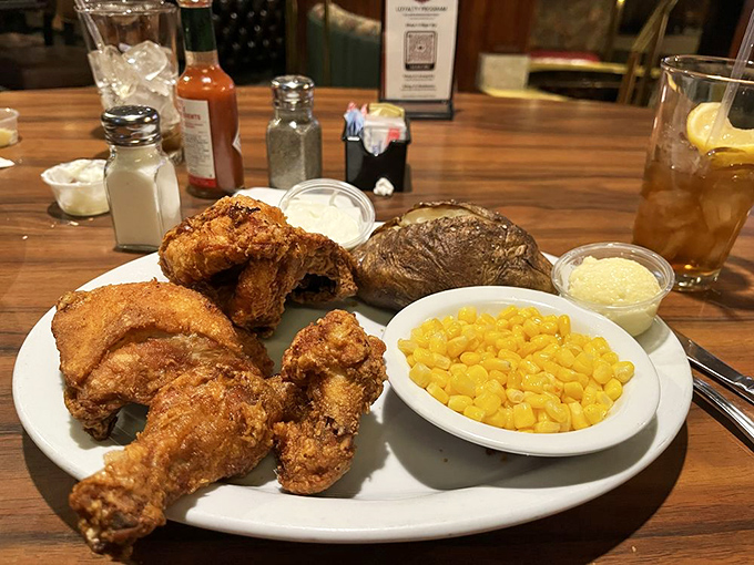 Fried chicken that would make your grandmother jealous, golden-brown and perfectly crisp alongside buttery corn and a baked potato.