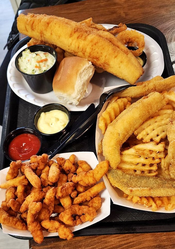 The seafood trifecta that dreams are made of. Perch, clams, and onion rings sharing a tray like old friends at a reunion&mdash;and you're invited to the party.