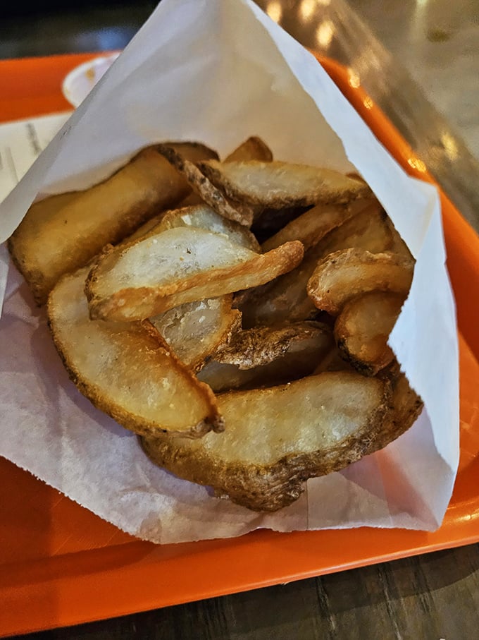 Golden, crispy potato perfection that makes you wonder if fries were actually the point all along. The burger might be jealous.