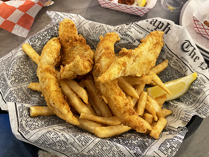 Newspaper-wrapped fish and chips&mdash;because sometimes the classics don't need reinvention, just perfect execution. That golden batter deserves a Pulitzer.