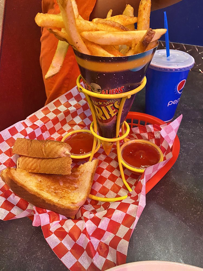 Comfort food gets the space treatment with this grilled cheese and cosmic fries. The sauce holders look like they're preparing for liftoff!