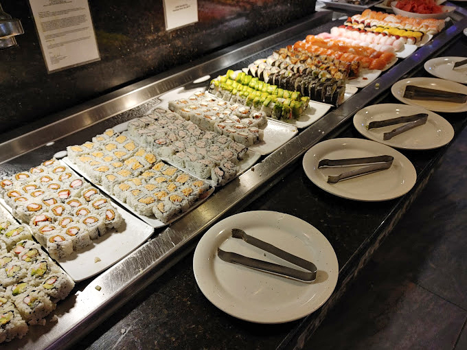 Like colorful jewels in a treasure chest, these maki rolls stand at attention, each promising a perfect bite-sized explosion of flavor and texture.