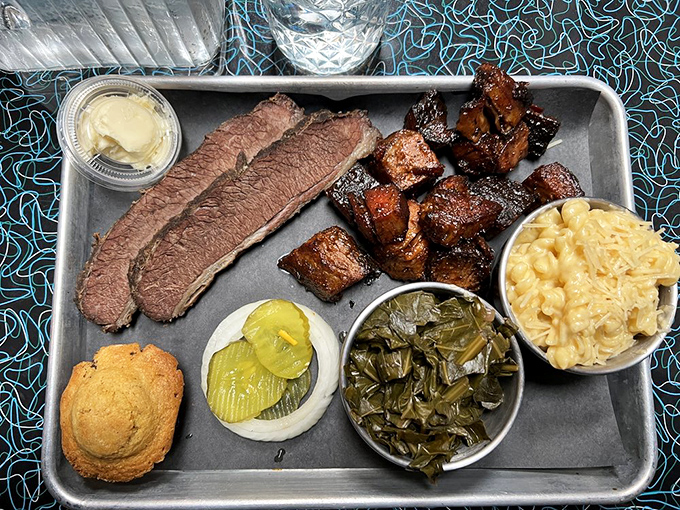 A meat lover's dream team: perfectly smoked brisket, burnt ends, and sides that don't know they're supposed to be supporting players.