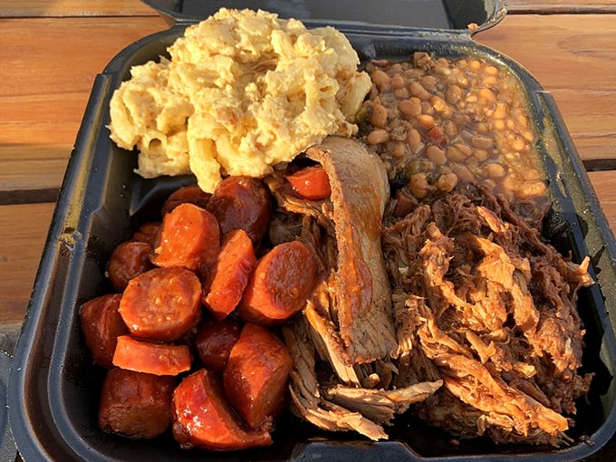 This isn't just a meal, it's a flavor fiesta! The brisket, pulled pork, and sides are having a party on this plate.