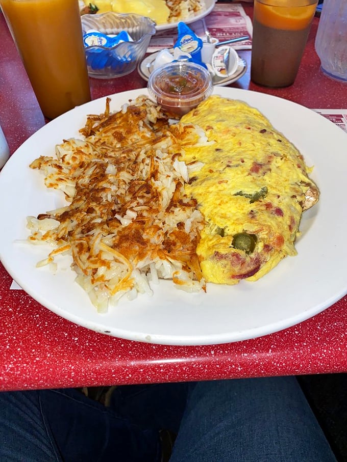 Morning glory on a plate! This omelet and its crispy potato sidekick are the dynamic duo your breakfast dreams have been waiting for.