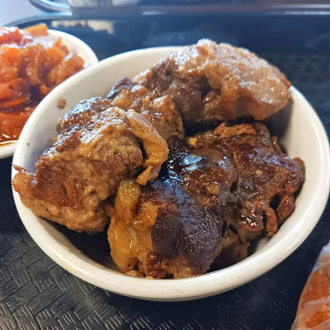 Oxtails so tender they practically surrender to your fork. This slow-cooked masterpiece transforms a humble cut into something worth crossing state lines for.