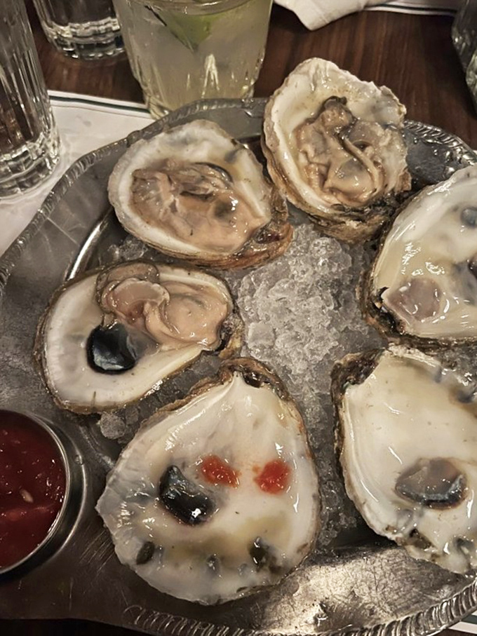 These oysters aren't just fresh—they're having a better day than most of us, lounging on ice like celebrities at a particularly exclusive spa.