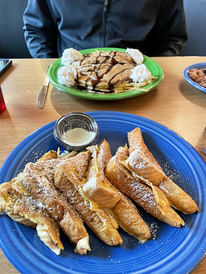 Pancakes drizzled with chocolate and crowned with whipped cream share the table with golden French toast&mdash;breakfast's greatest hits album.
