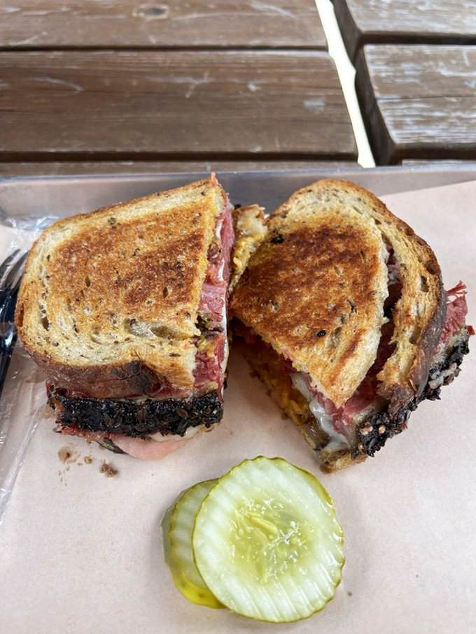 This sandwich isn't just lunch; it's architecture. Layers of smoky meat and melted cheese between perfectly grilled bread create edible engineering.