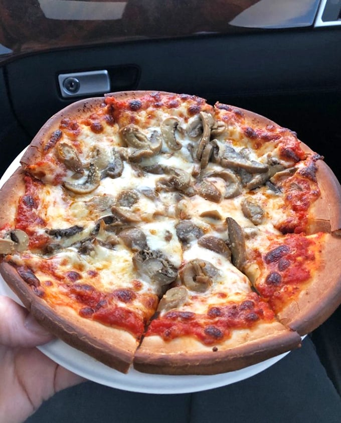 The poppy seed bun cradles this masterpiece like it was destined for greatness. A burger that doesn't need Instagram filters to look this good.