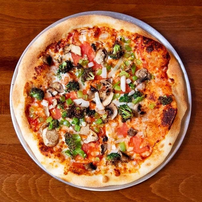 Wait, pizza at a deli? When it looks this good &ndash; crisp crust, fresh veggies, and cheese bubbling to golden perfection &ndash; who's going to argue with tradition?