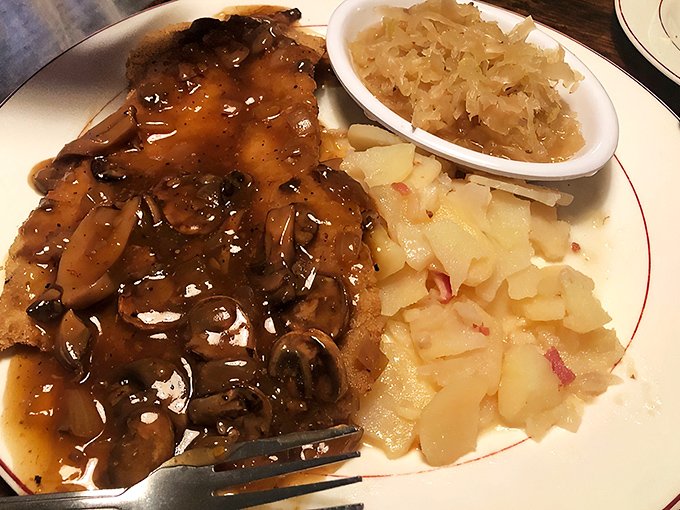 The potato salad doesn't just share the plate&mdash;it steals the show with its vinegary tang and perfect texture that puts mayo-based versions to shame.