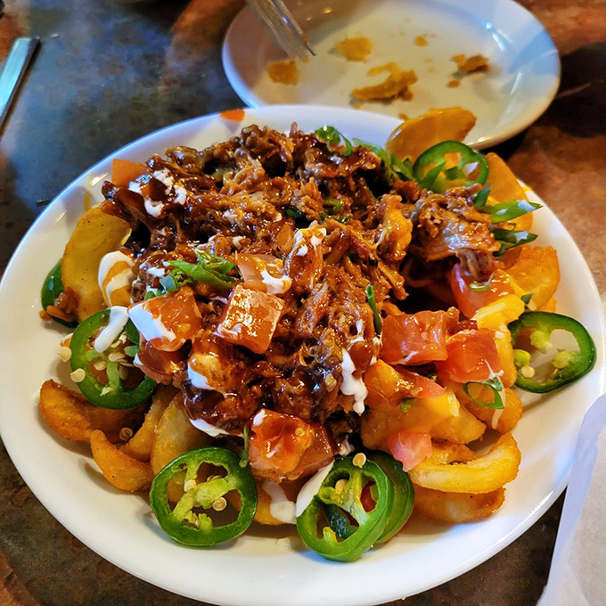 Loaded sidewinder fries that don't know whether they're an appetizer or a life-changing experience. Those jalape&ntilde;os are the exclamation points on a sentence of flavor.