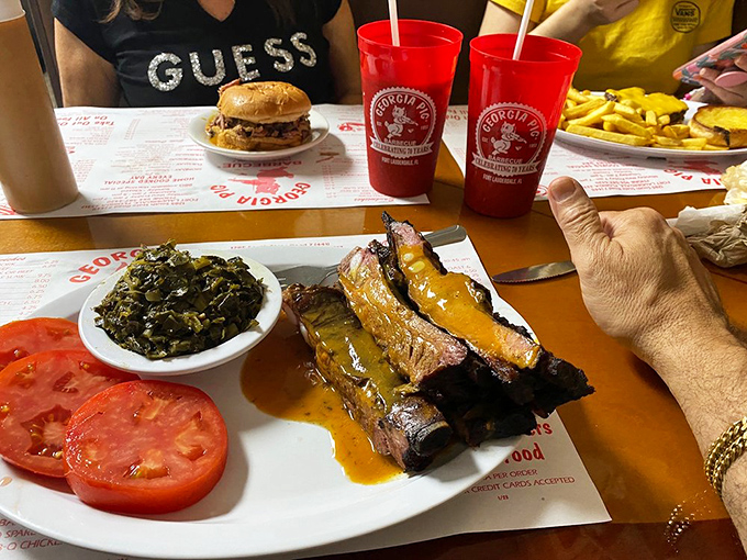 This plate represents barbecue perfection &ndash; ribs glistening with sauce alongside beans that could convert any vegetarian temporarily.