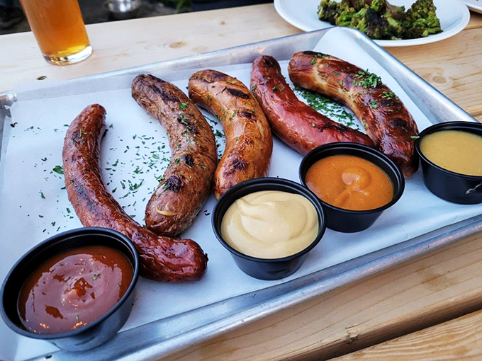 A sausage sampler that could make a Bavarian weep tears of joy, served with a United Nations of dipping sauces for diplomatic flavor relations.